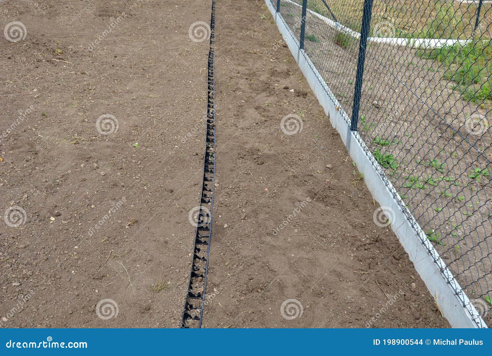 Assembly of Garden Curbs Made of Black Plastic. the Curb Separates ...