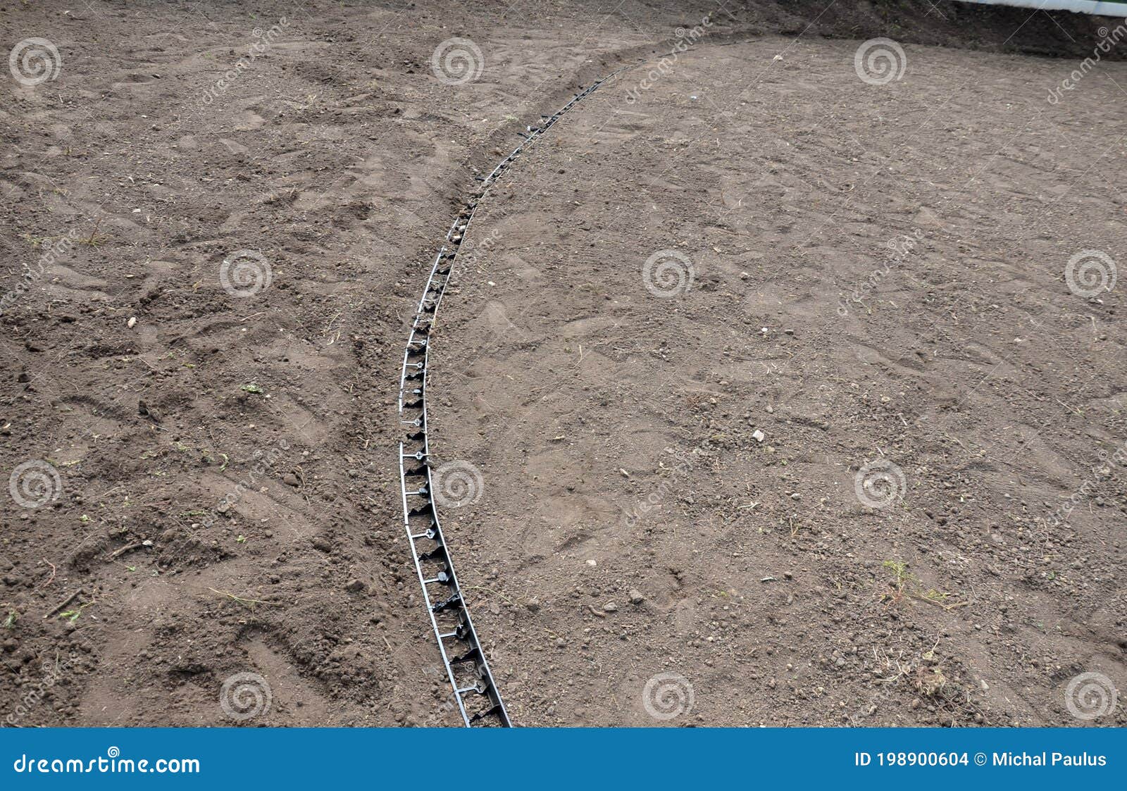 Assembly of Garden Curbs Made of Black Plastic. the Curb Separates ...