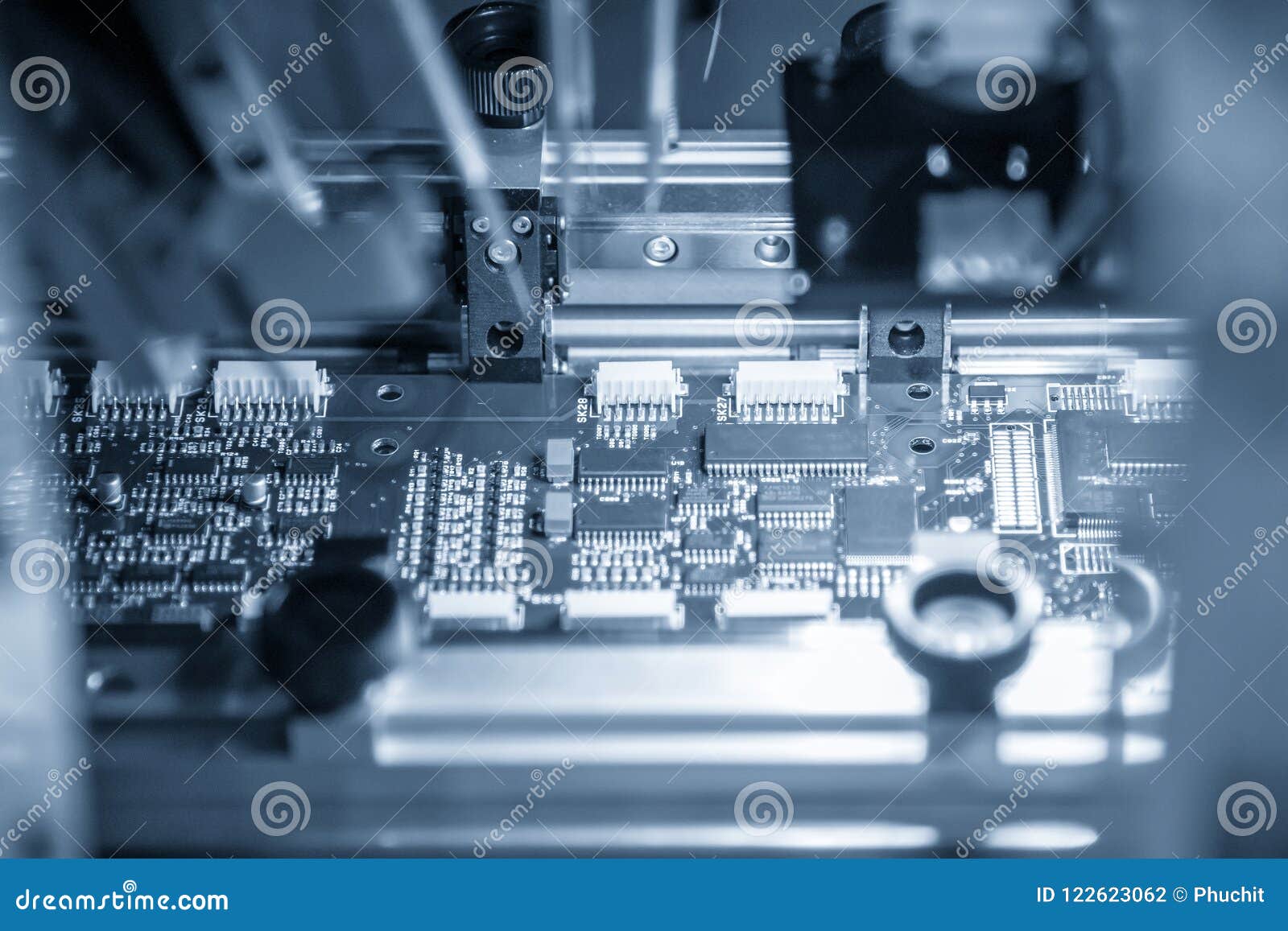 The Assembly Line Of Electronic Board With Microchip In The Light Blue