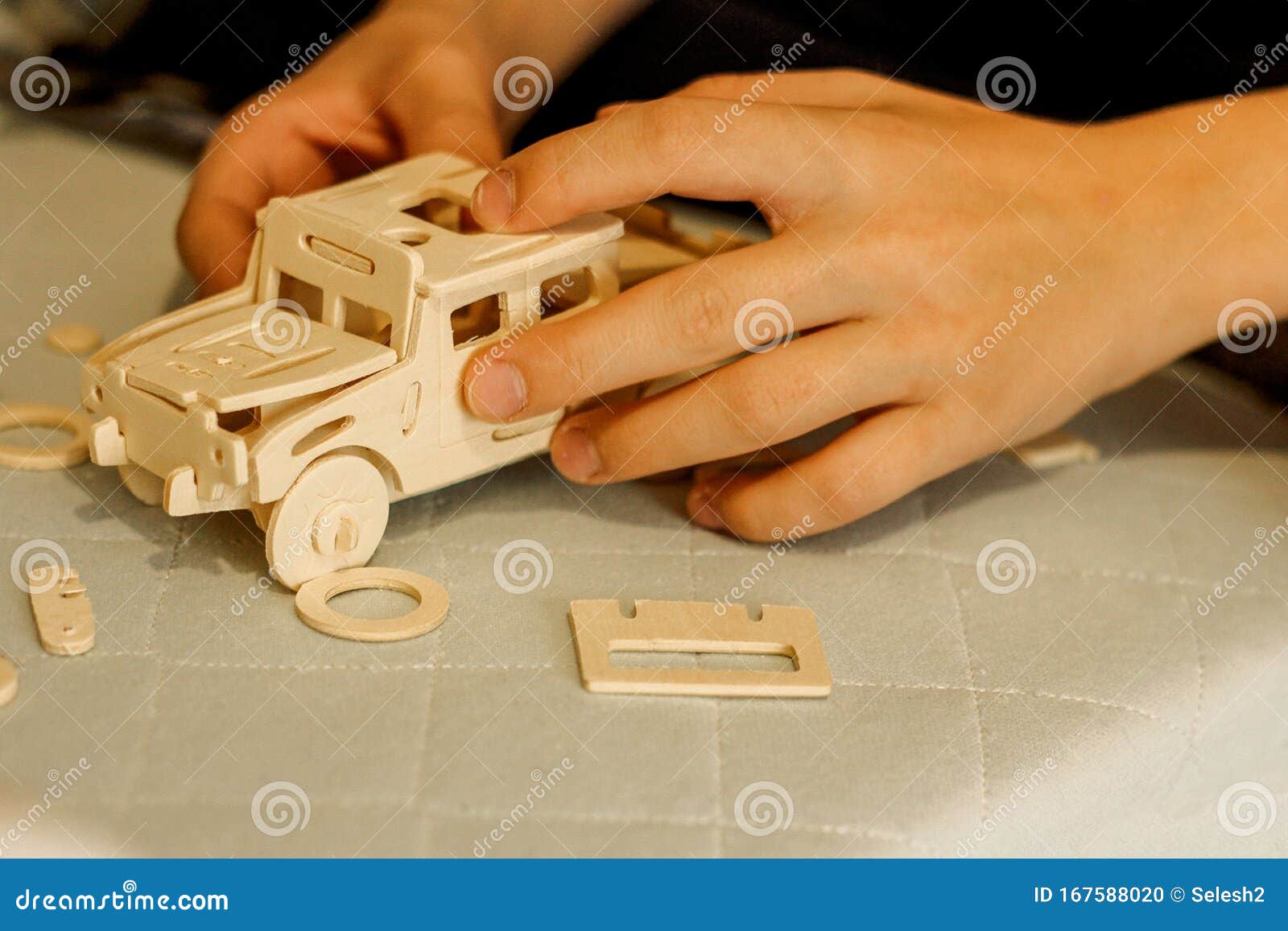 Assembly of the Machine Model from a Wooden Constructor Stock Photo ...