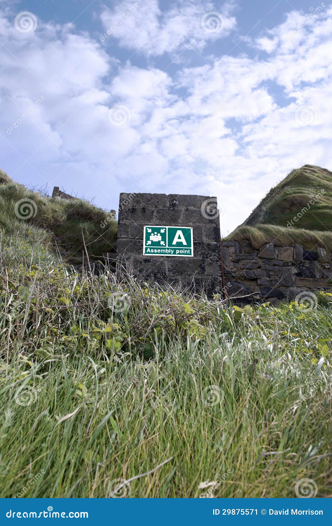 Beach Assembly Point Sign on a Block Wall Stock Image - Image of notice ...