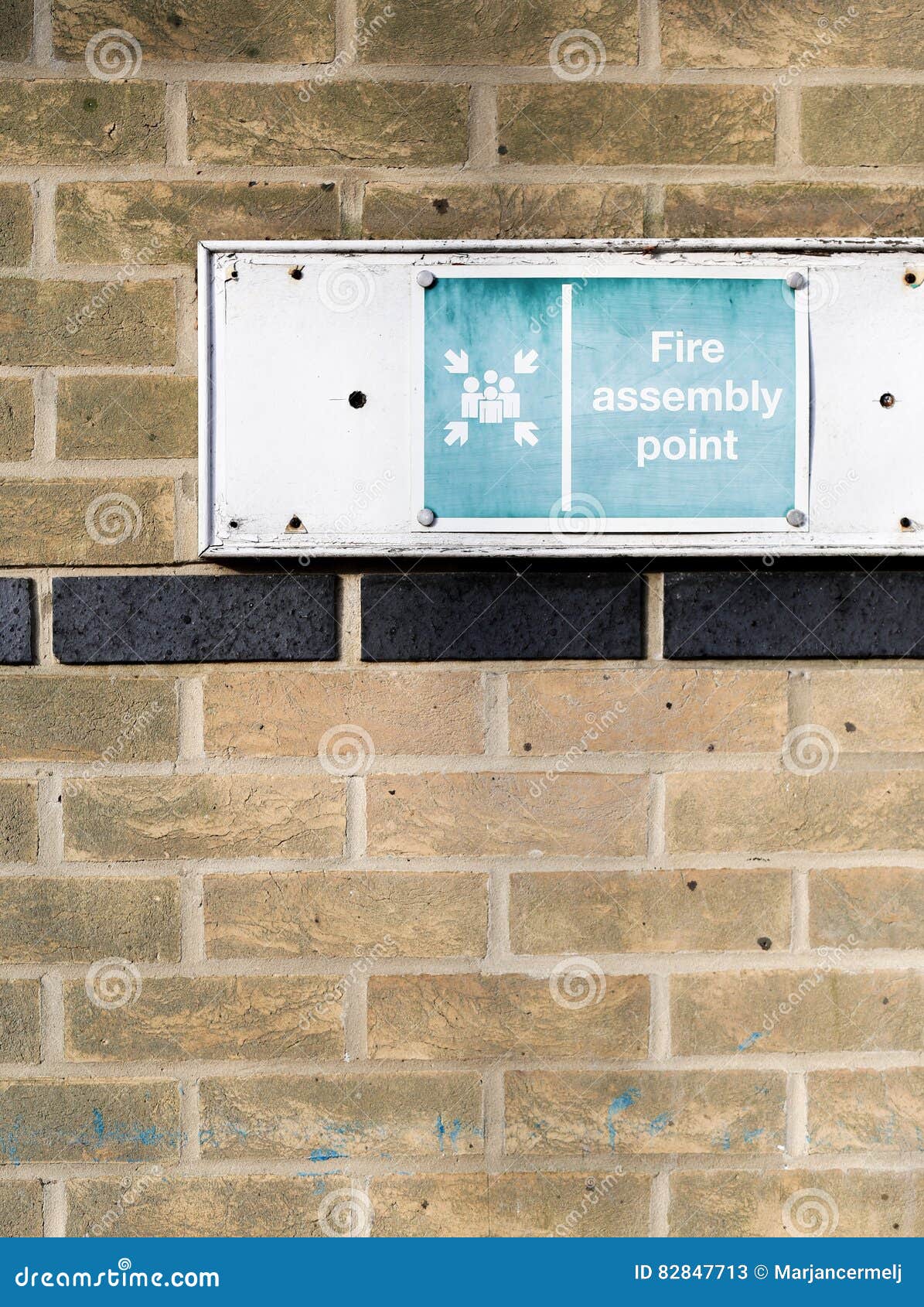 Assembly Point Sign on Brick Wall Stock Image - Image of text, notice ...