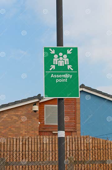 Assembly point sign stock photo. Image of pole, people - 52679488