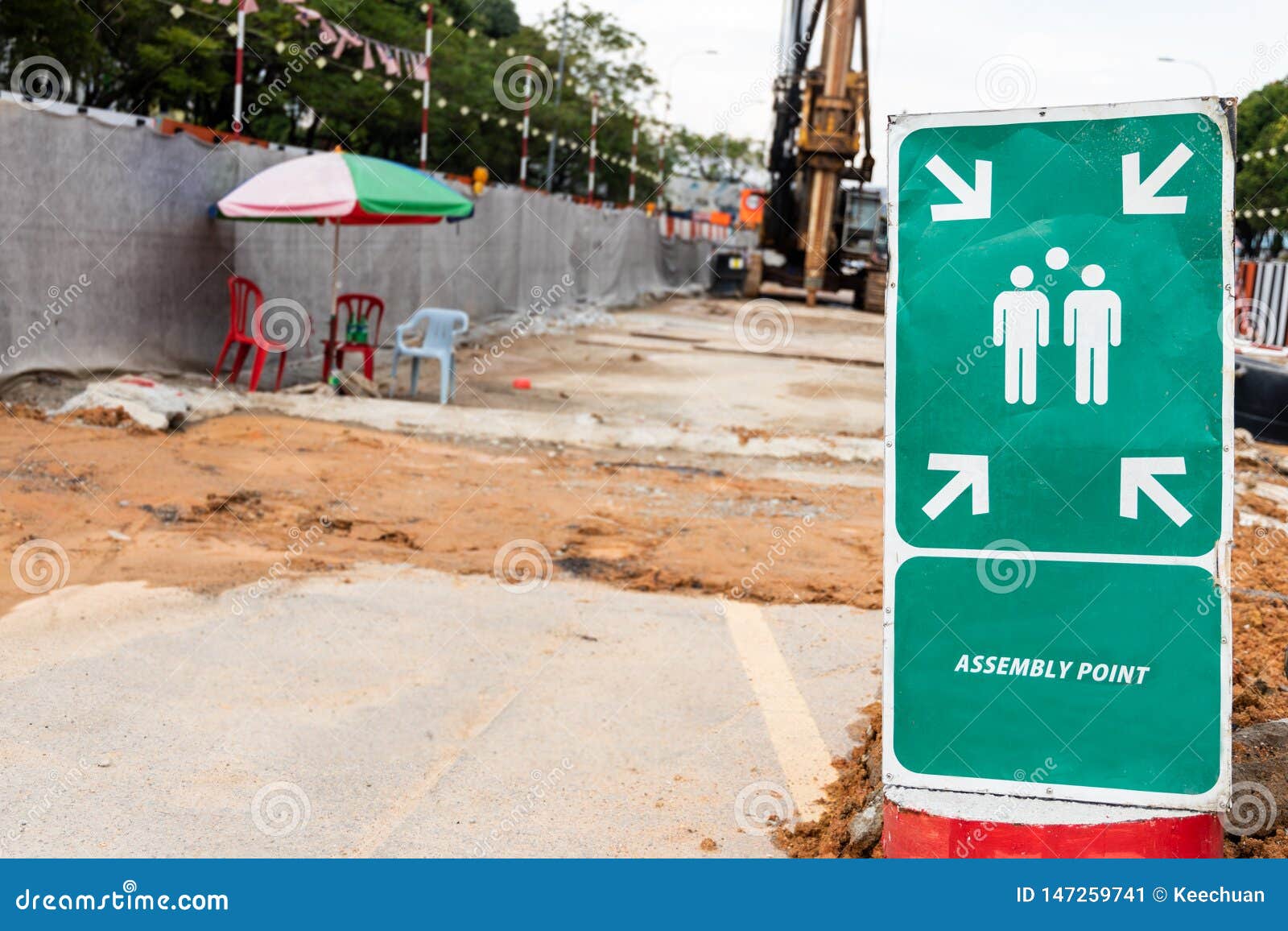 Assembly Point Signage with Construction Site Background Stock Image ...