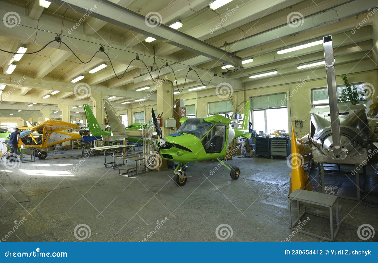 The Assembly Shop Interior. Light Plane, Worker Assembling a Body ...