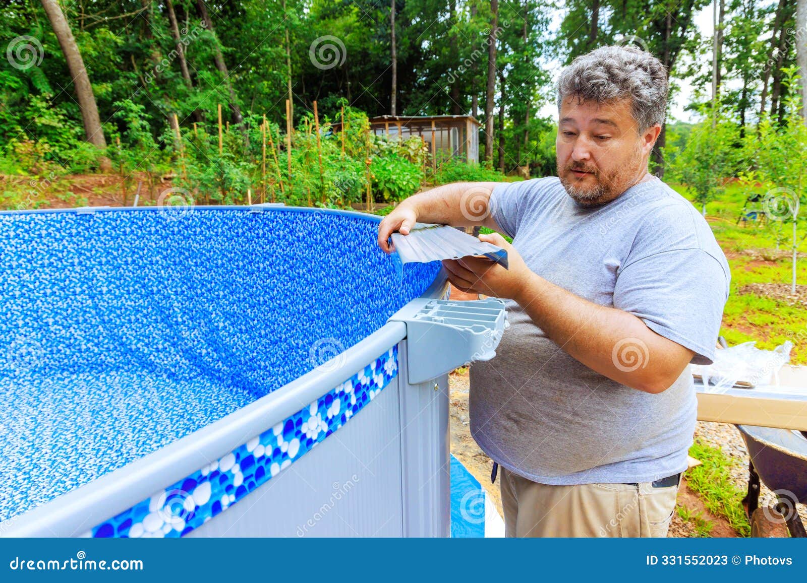 An Assembly of Swimming Pool Made of Construction Ground in Backyard of ...