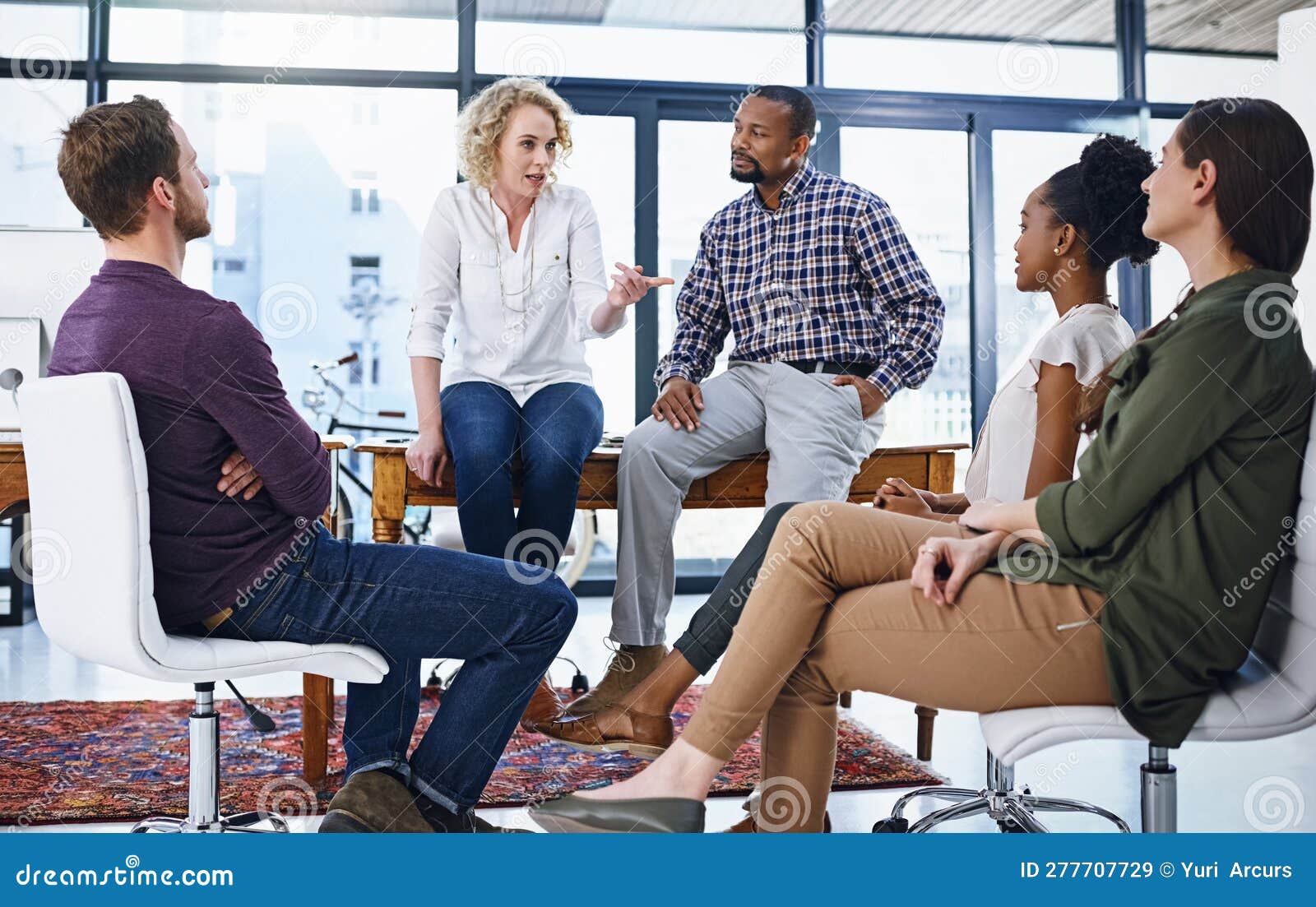 Assigning Out Tasks To Each Team Member. a Team of Designers Working ...