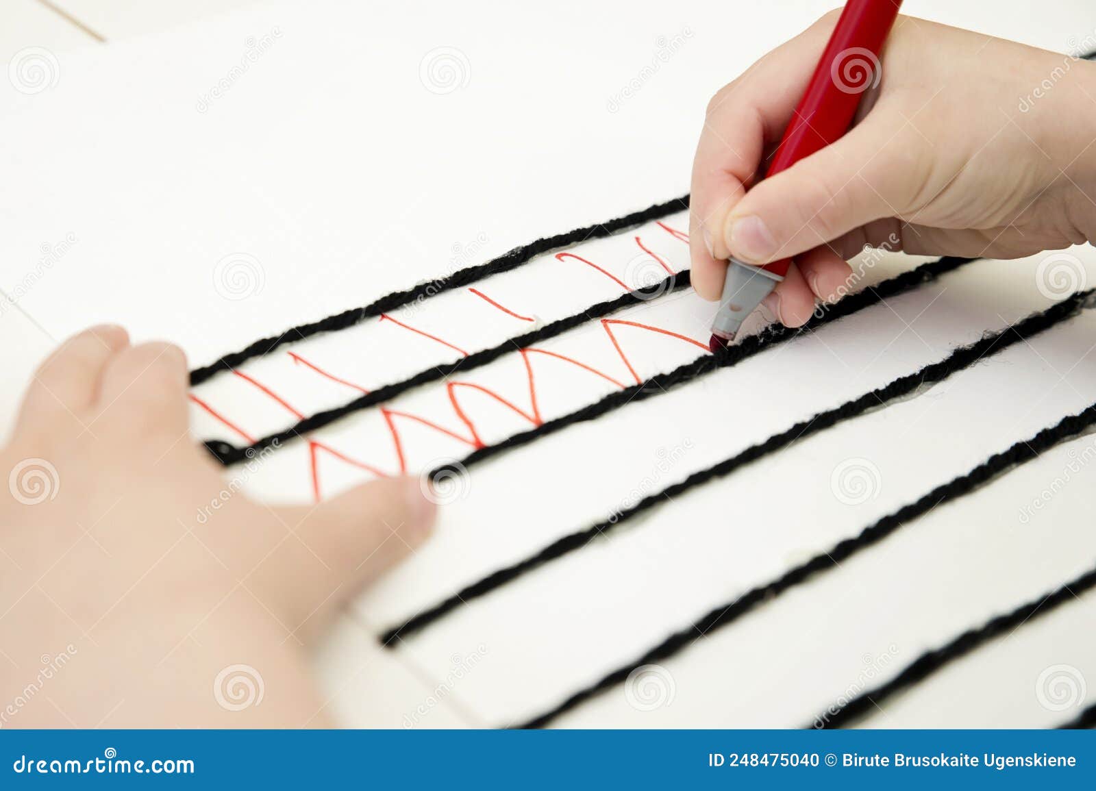 Child Learns To Write Symbols. Hand Training Tasks. Stock Photo - Image ...