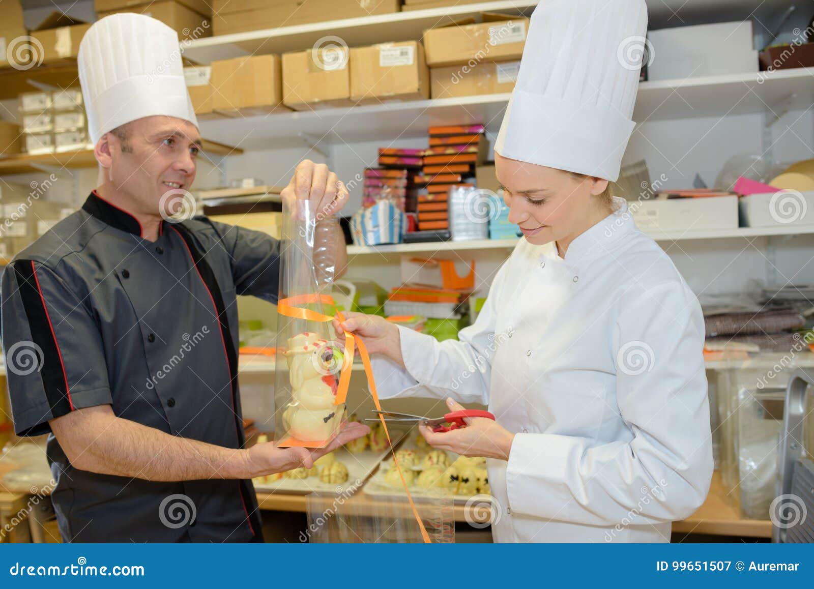 Assistant and Chef Discussing Menu in Kitchen Stock Image - Image of ...