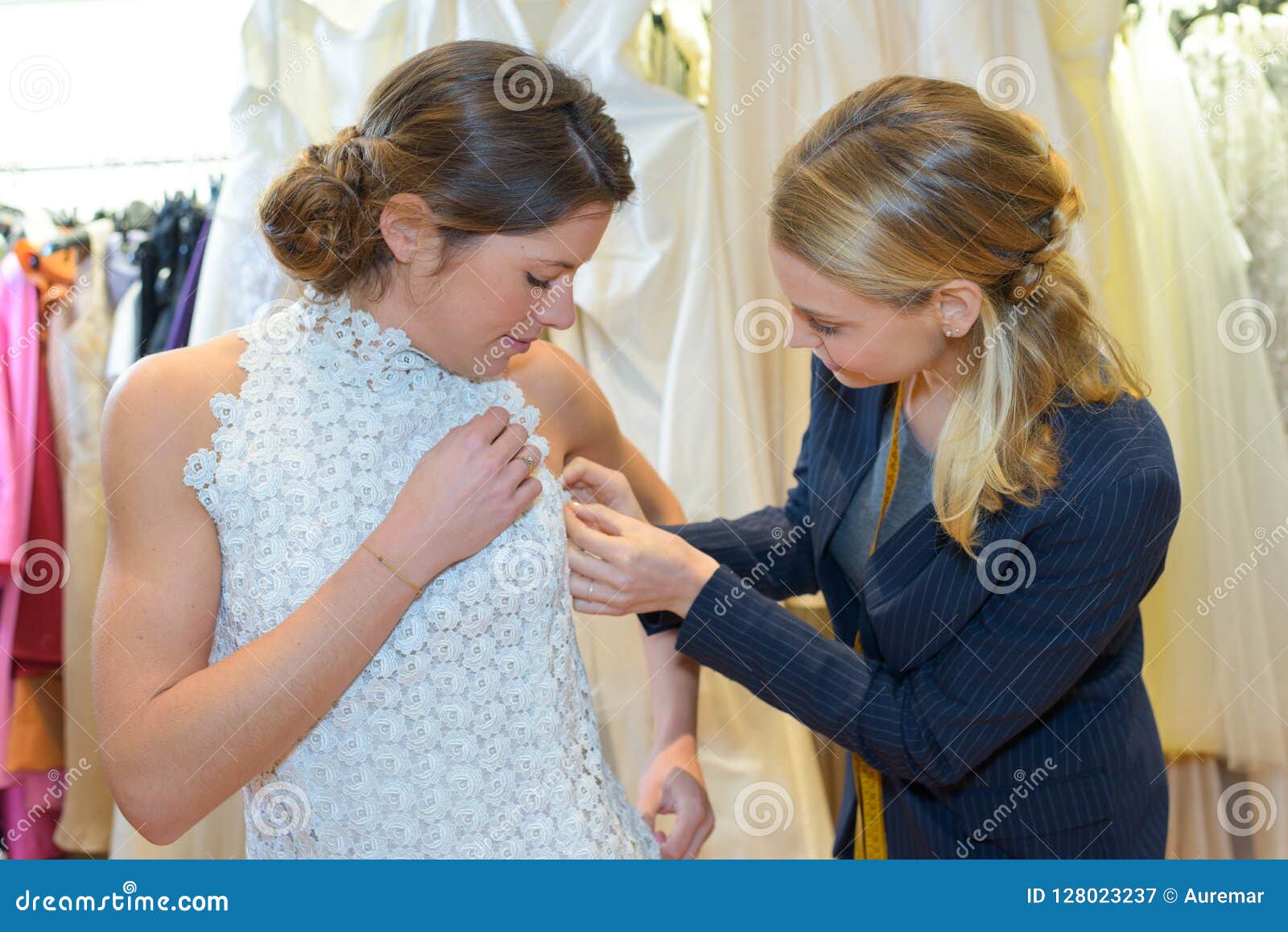 Assistant Fitting Lady into Wedding Gown Stock Image - Image of white ...
