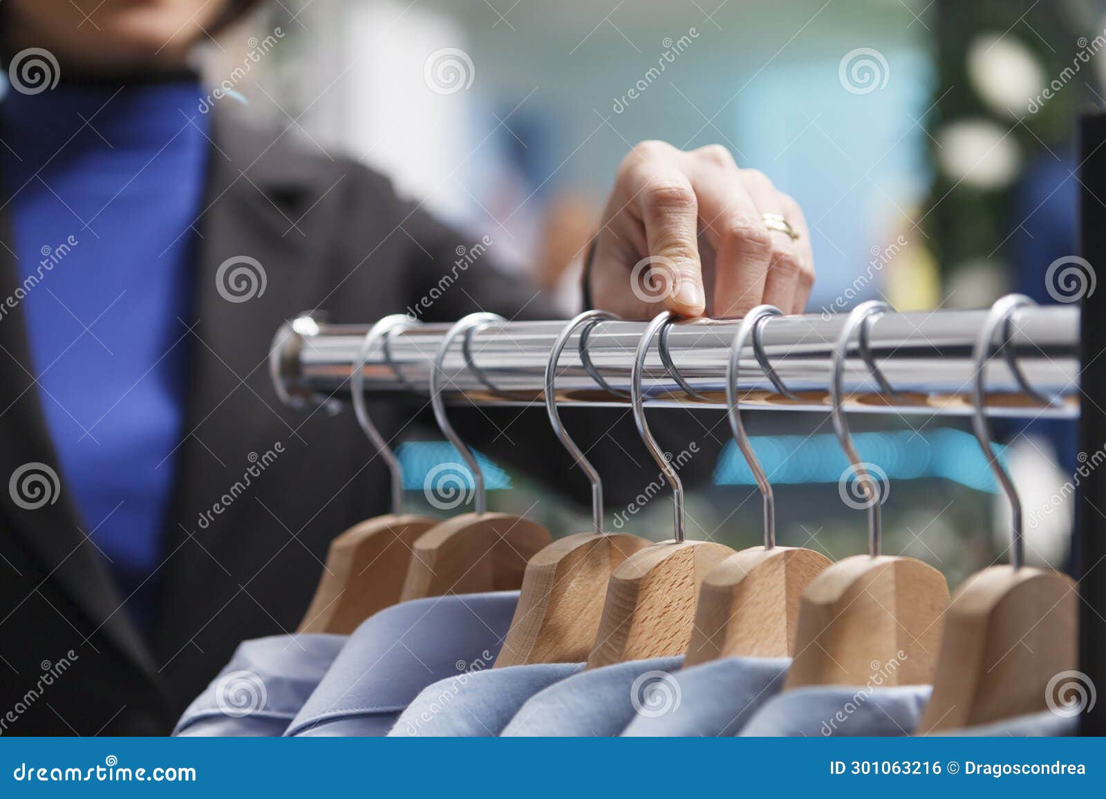 Assistant Hand Counting Apparel on Rack Stock Photo - Image of room ...
