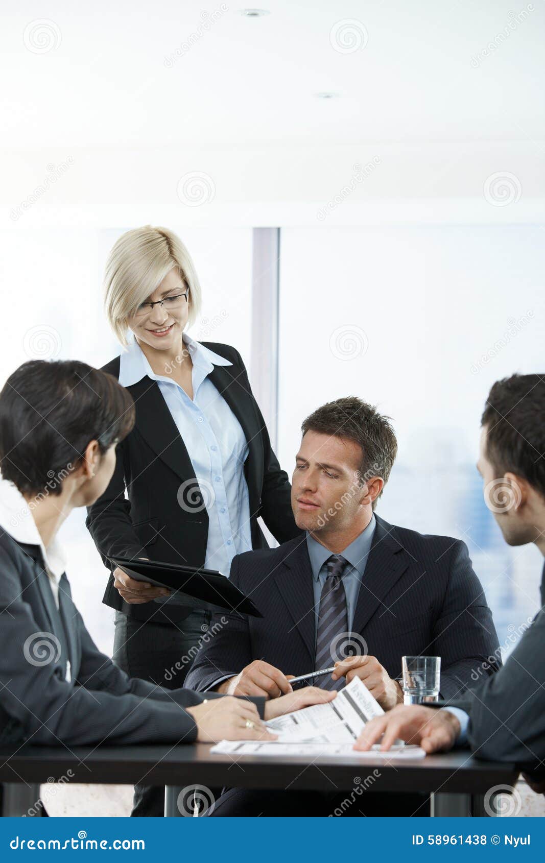 Assistant Handing Report at Meeting Stock Photo - Image of cooperating ...