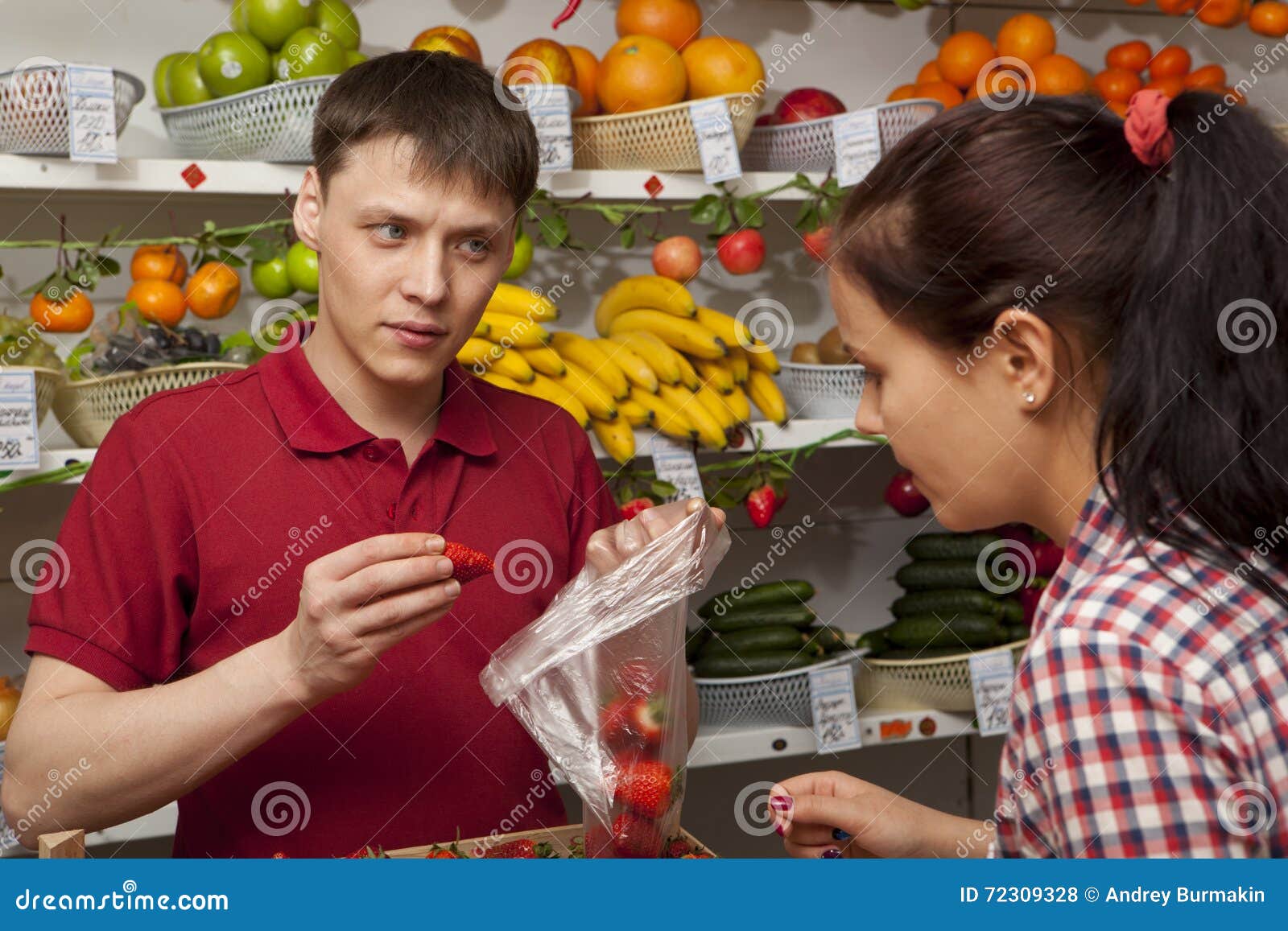 Assistant Helping Customer at Vegetable Counter of Shop Stock Photo ...