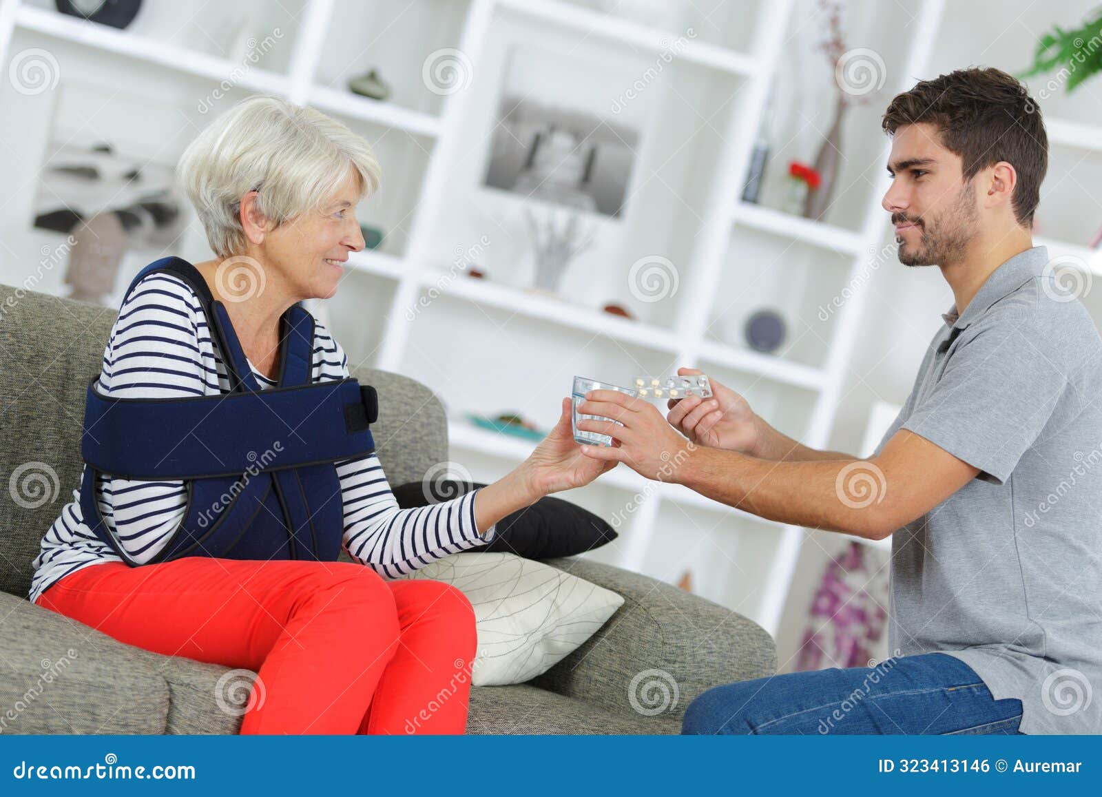 Assistant Helping Smiling Senior Woman in Rest-home Stock Photo - Image ...