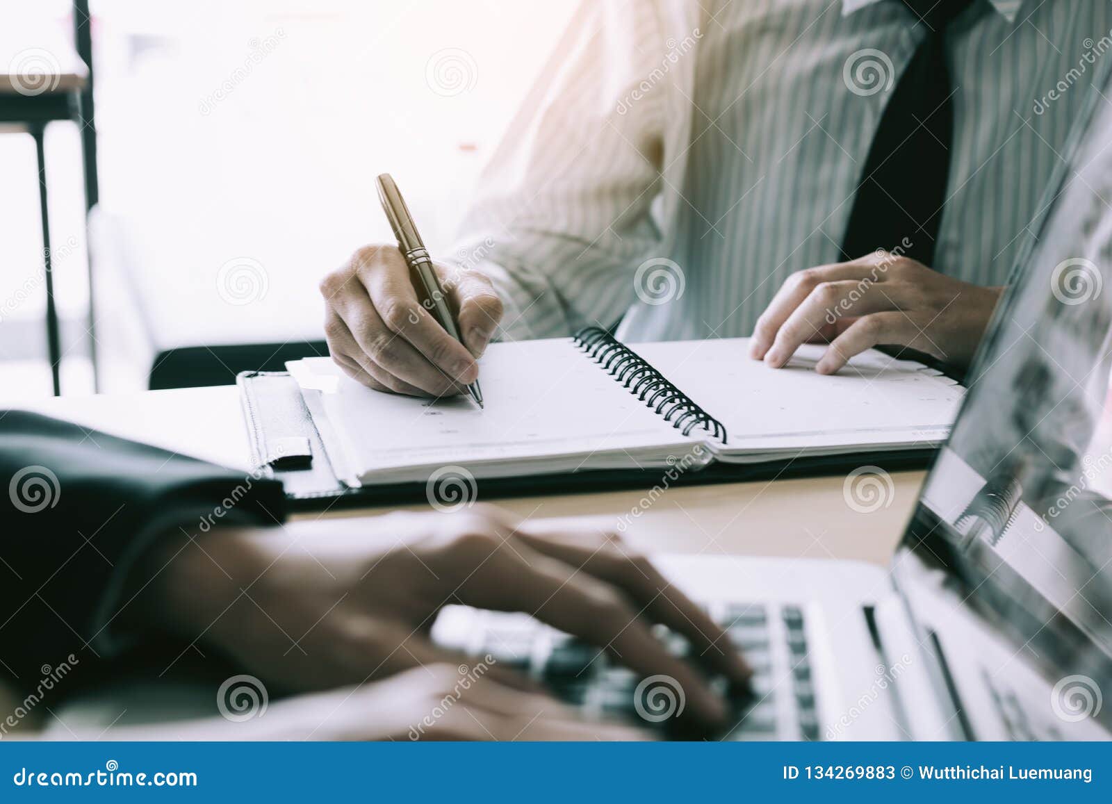 Assistant Manager is Taking Notes To the Supervisor Who is Using the ...
