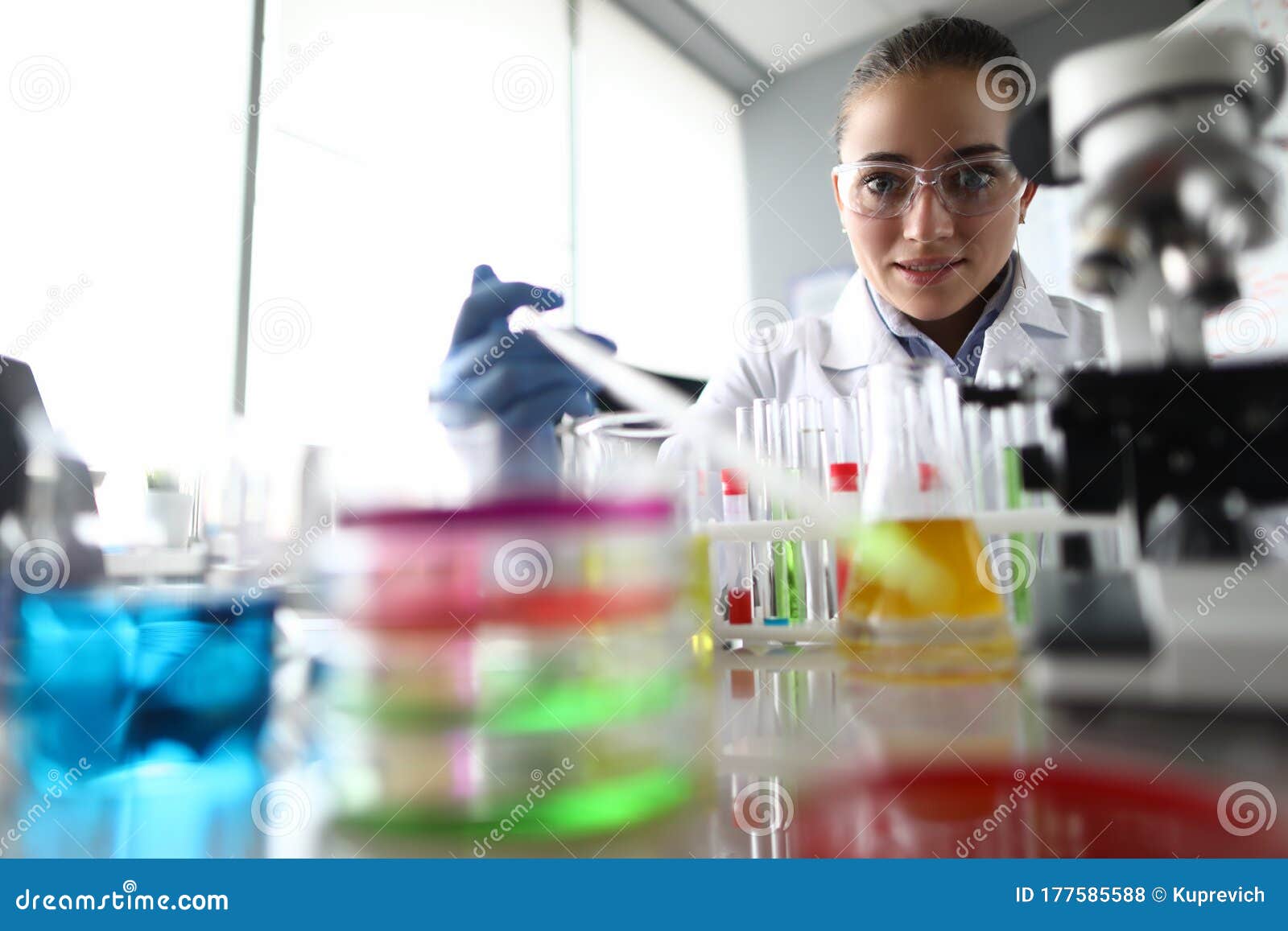 Assistant Pouring Liquid into Flask Stock Photo - Image of concept ...