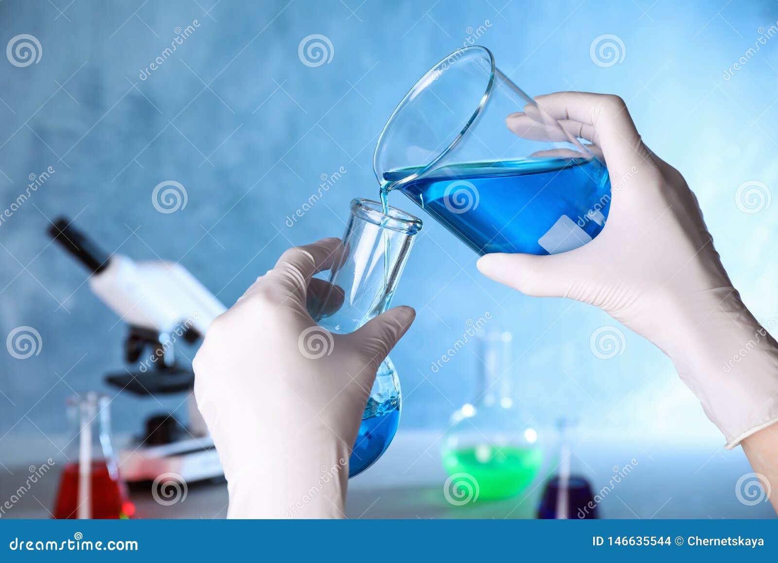 Assistant Pouring Sample into Glass Flask in Chemistry Laboratory Stock ...