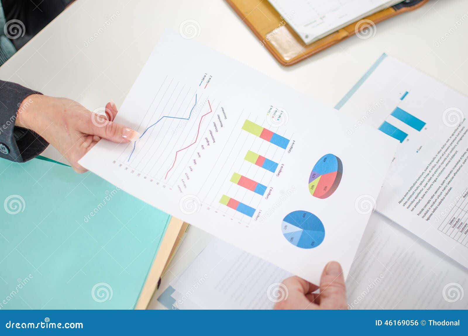 Assistant Showing Graphs To Her Boss Stock Photo - Image of document ...