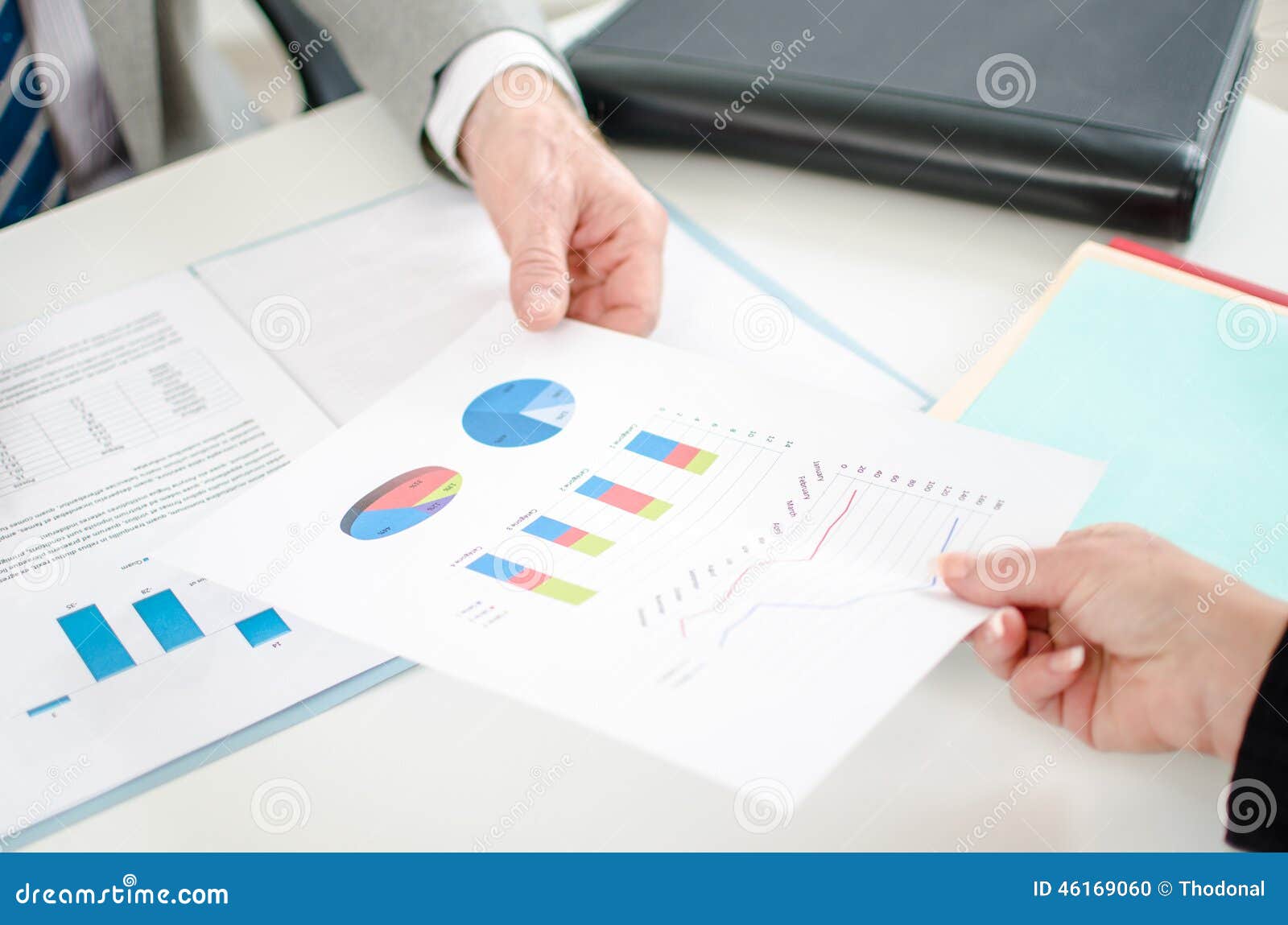 Assistant Showing Graphs To Her Boss Stock Photo - Image of teamwork ...