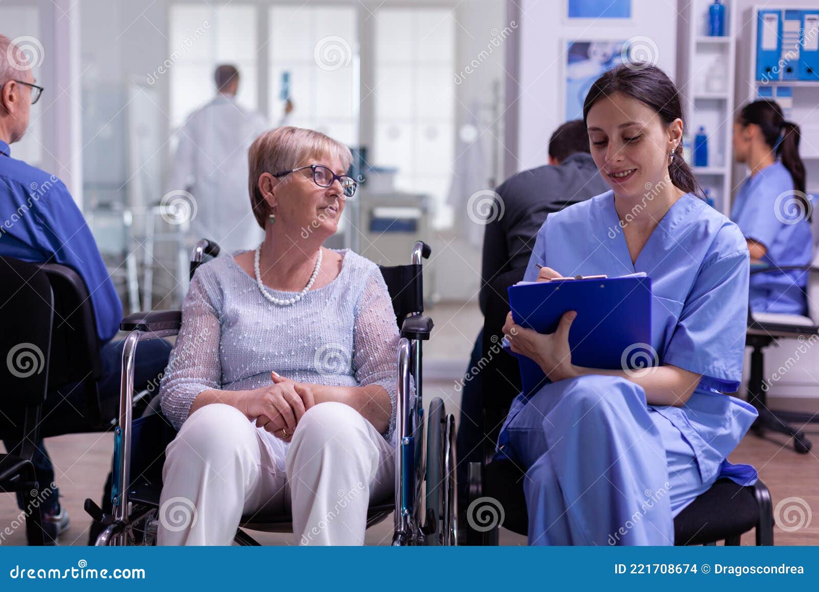 Assistant Taking Notes on Clipboard about Patient Madical Problems ...