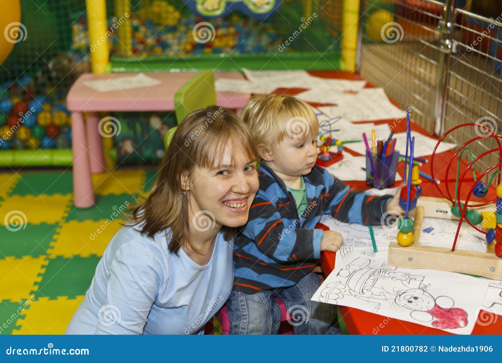 Assisting Baby in Playground Stock Photo - Image of help, playground ...