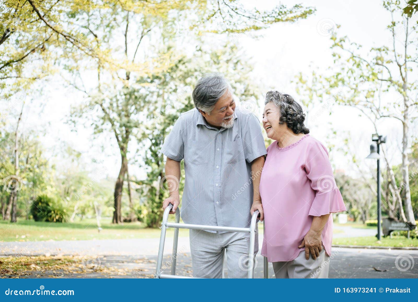 Assisting Her Senior Patient Who`s Using a Walker Stock Image - Image ...