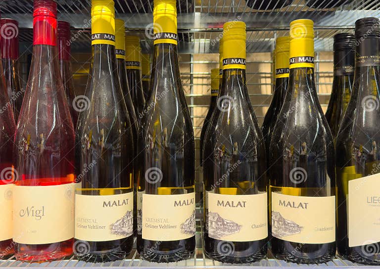 Assorted Austrian Wine Bottles on Display Shelf with Varied Labels ...