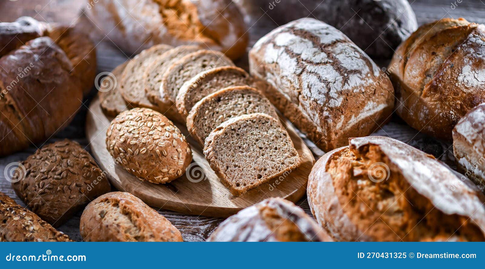 Assorted Bakery Products Including Loaves of Bread and Rolls Stock ...