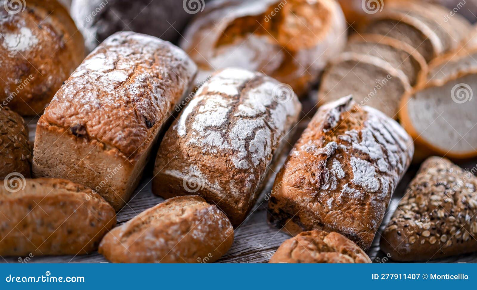 Assorted Bakery Products Including Loaves of Bread and Rolls Stock ...
