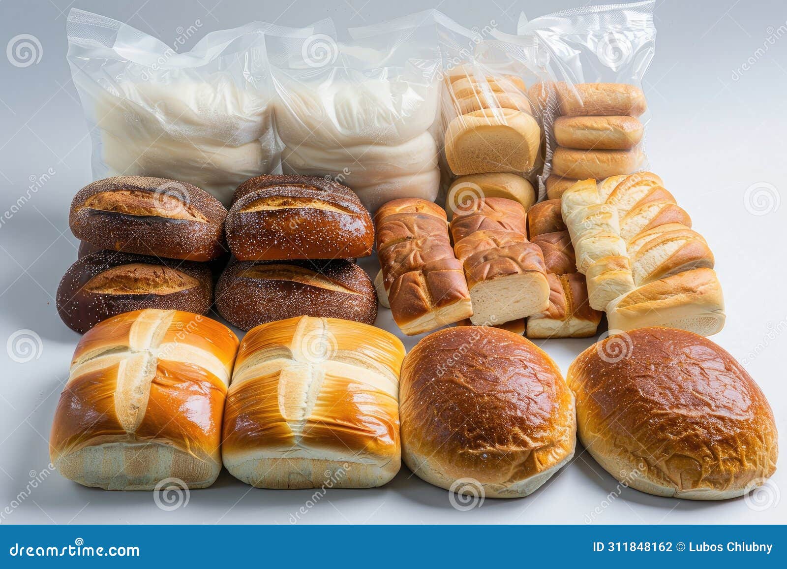Assorted Bakery Products Including Loaves of Bread and Rolls Stock ...