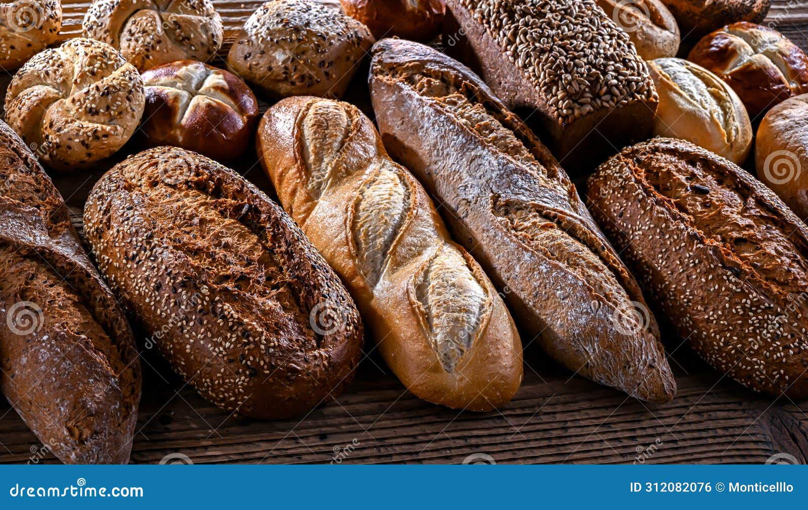 Assorted Bakery Products Including Loaves of Bread and Rolls Stock ...