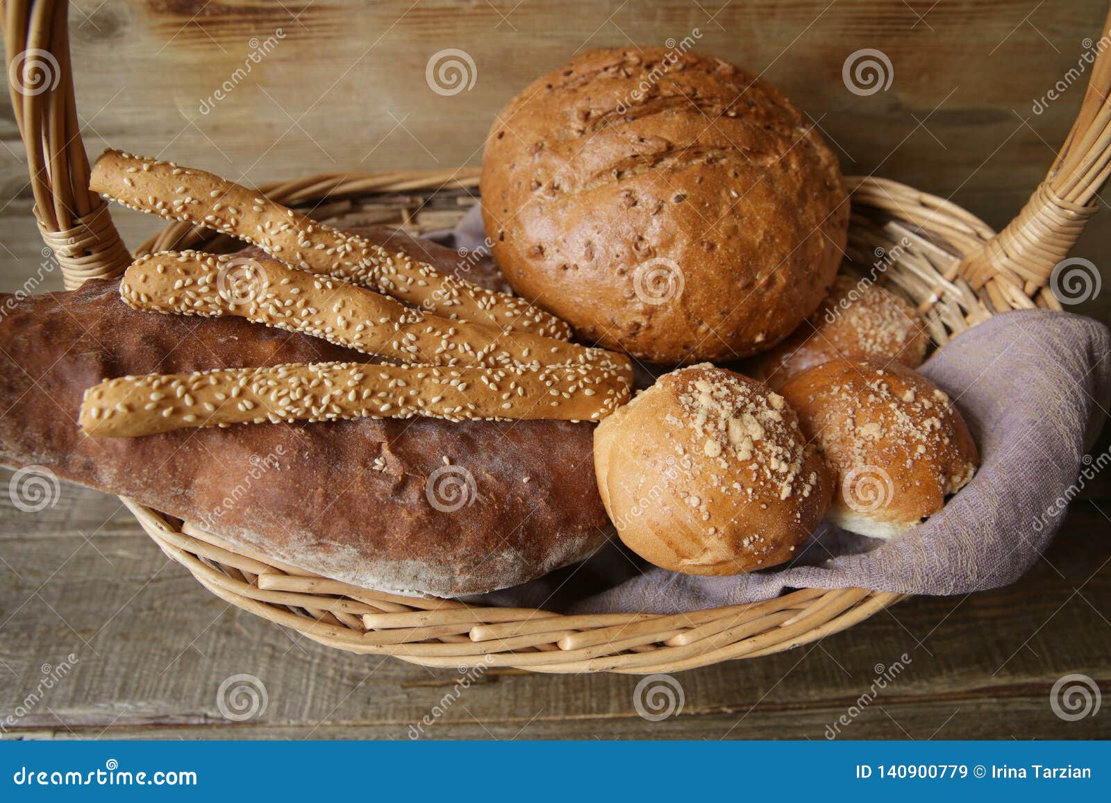 Assorted Bread and Sesame Breadsticks in a Basket on a Wooden Rustic ...