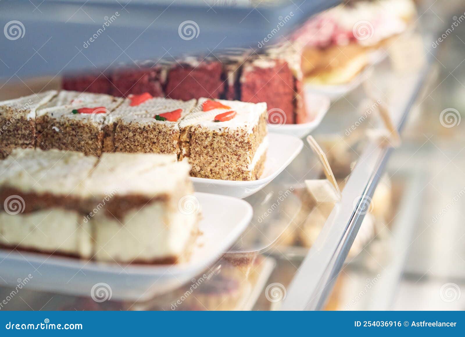 Assorted Cakes with Cream on the Showcase of the Cafe Stock Photo ...