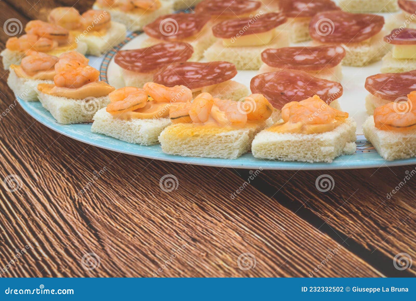 Assorted Canapes on a Wooden Table Stock Photo - Image of bread, salami ...