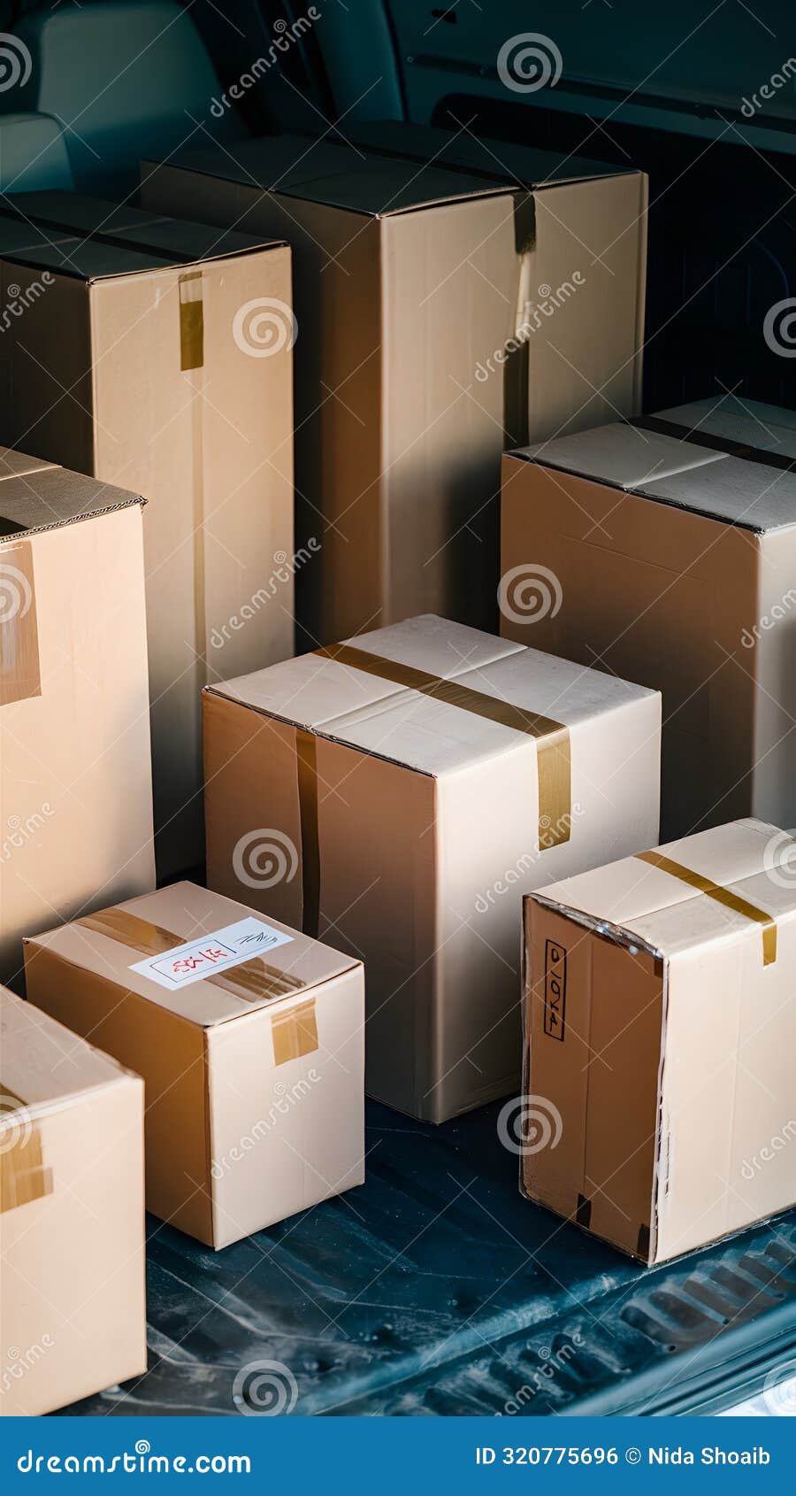 Assorted Cardboard Boxes in Vehicle, Various Sizes and Labels, with ...