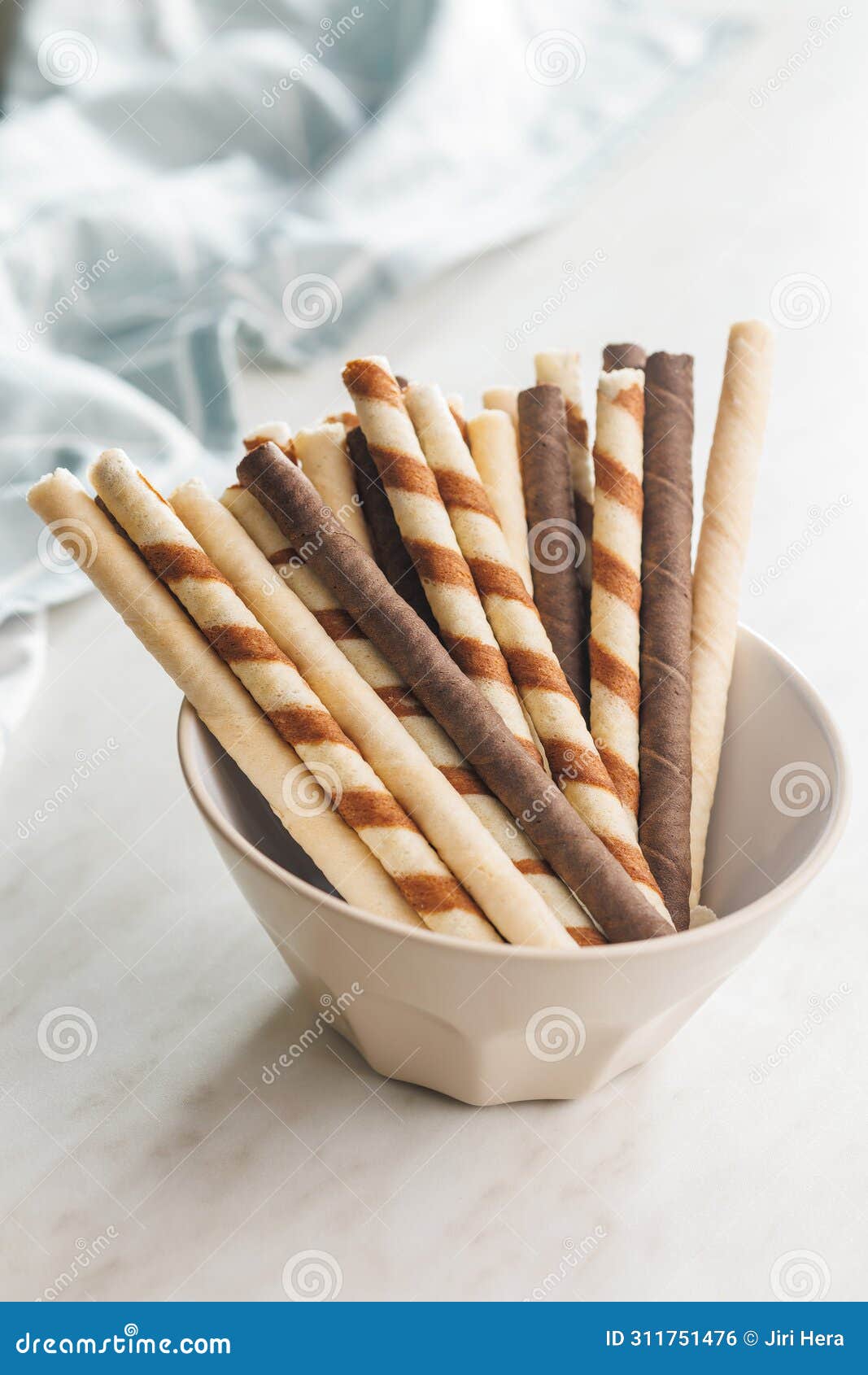 Assorted Chocolate and Vanilla Cream Filled Wafer Rolls in Bowl on ...