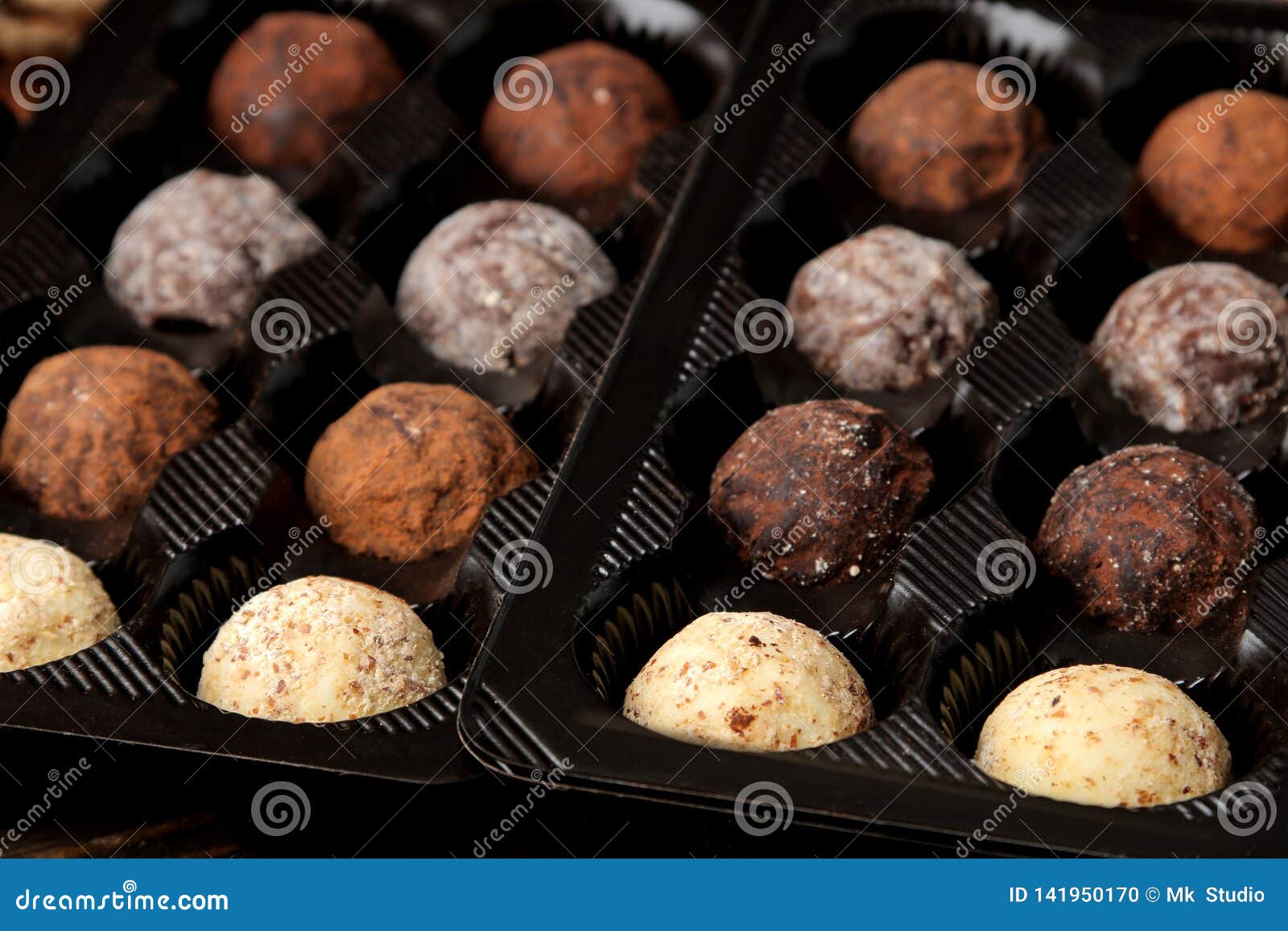 Assorted Chocolates. Candy Balls of Different Types of Chocolate in a ...
