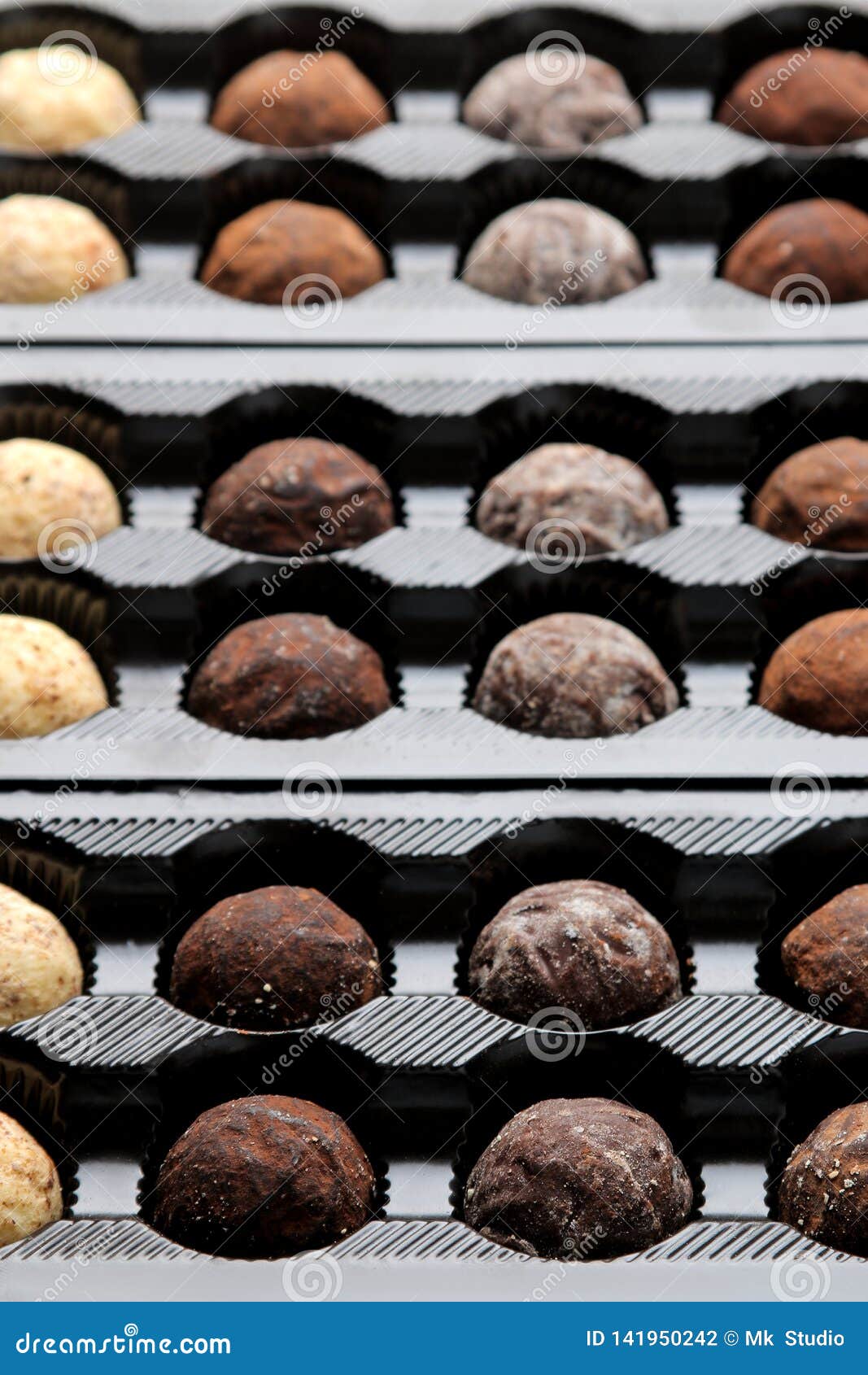 Assorted Chocolates. Candy Balls of Different Types of Chocolate in a ...