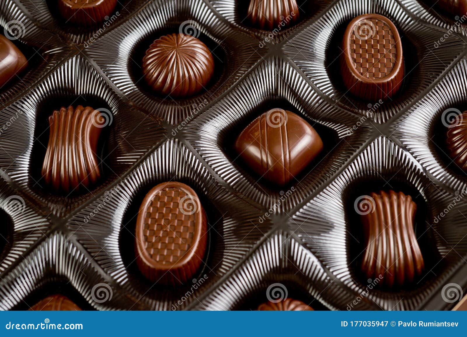 Assorted Chocolates Lying in a Box. Background for Products from ...