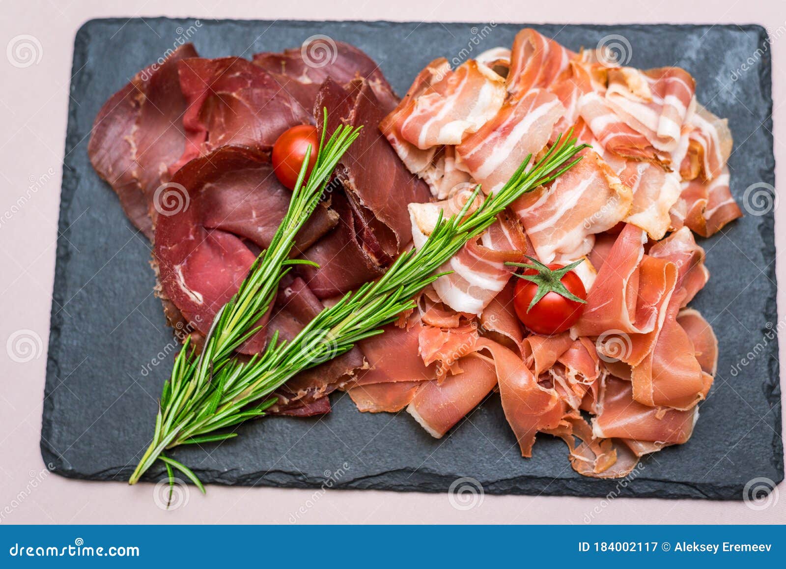 Assorted Cold Cuts with Herbs on a Plate. Horizontal Frame Stock Image ...