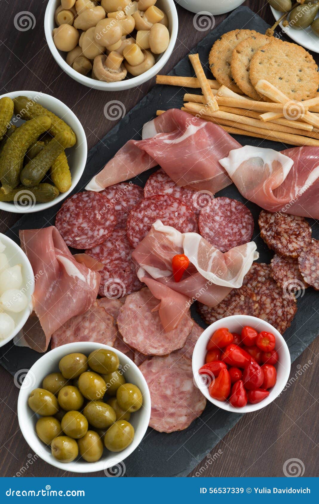 Assorted Deli Meat Snacks, Sausages and Pickles on a Blackboard Stock ...