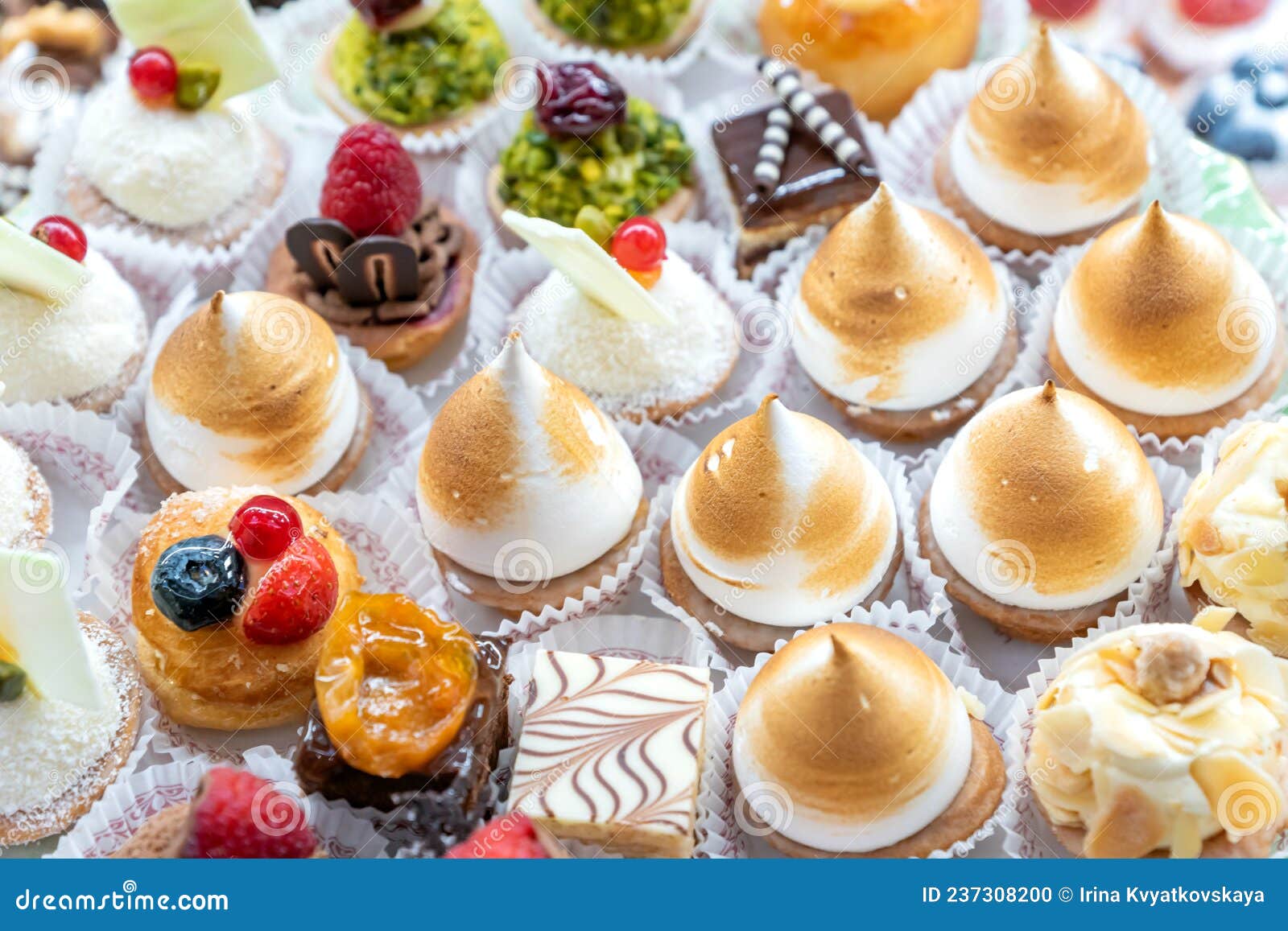 Assorted Different Mini Cakes with Cream, Chocolate and Berries- Sweets ...