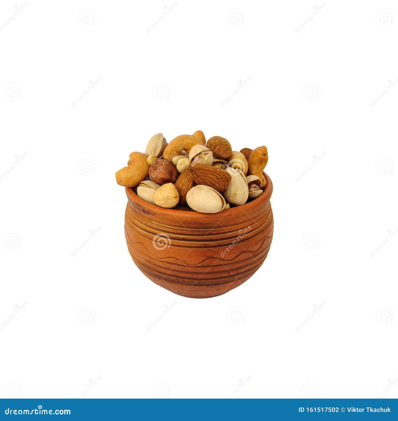 Assorted Different Nuts in a Clay Mug on a White Background. Side View ...