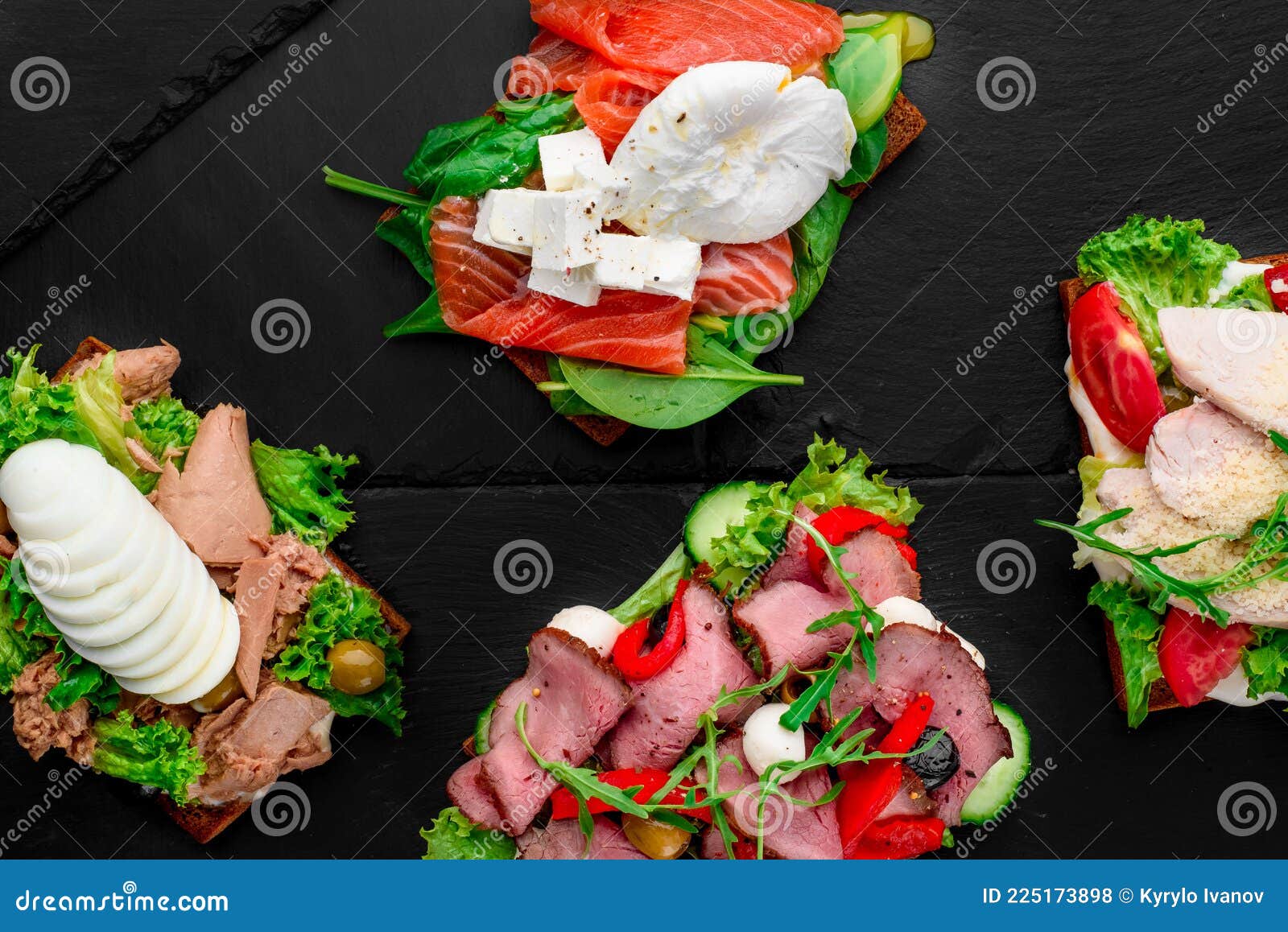 Assorted Different Toasts with Salmon, Meat, Eggs, Tomatoes and Cheese ...