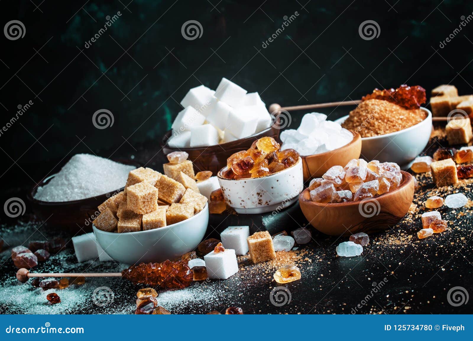 Assorted Different Types of Sugar in Bowls on a Table on a Dark Stock ...
