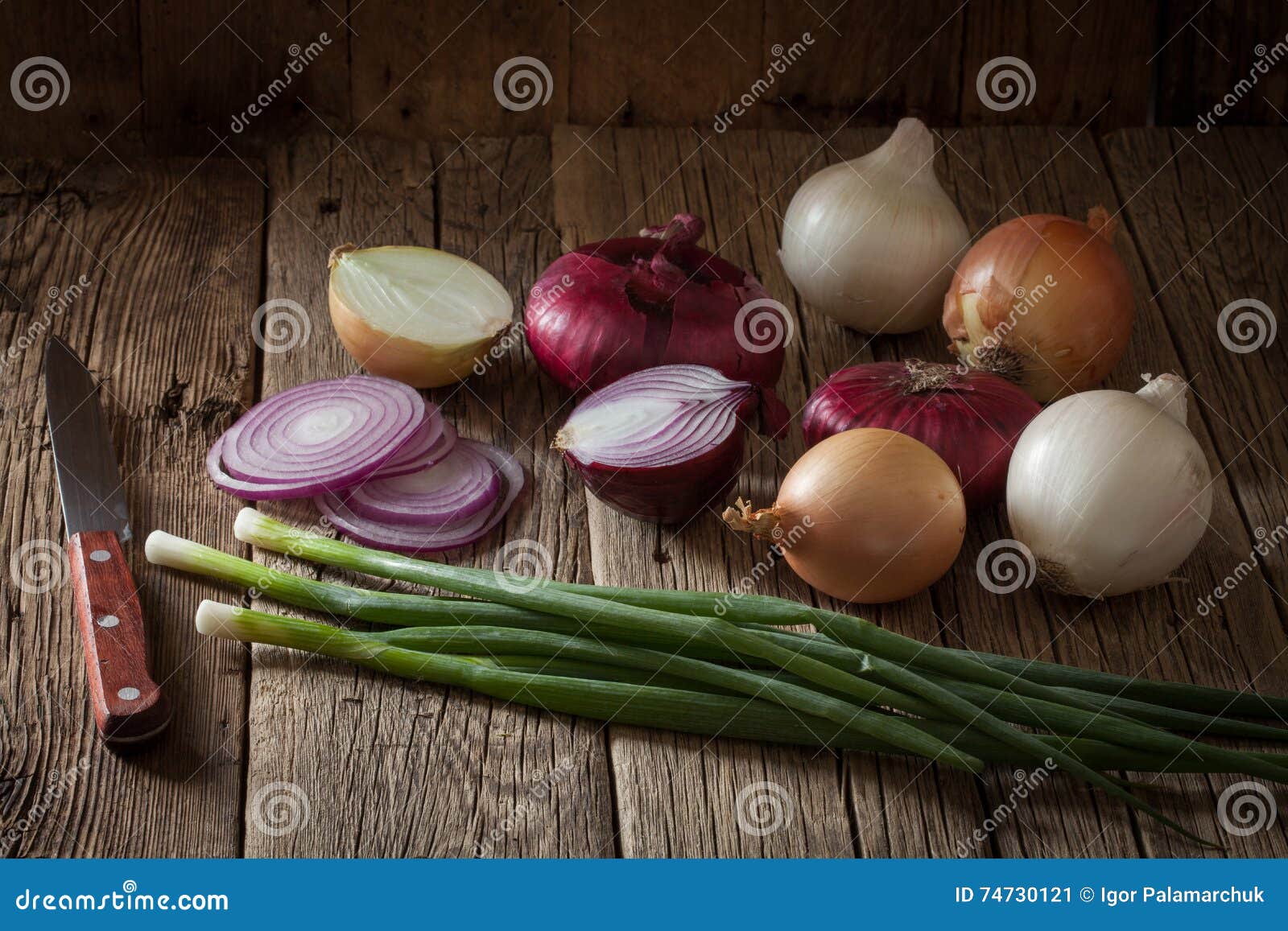 Assorted Farm Fresh Onions on a Wooden Table with Spring Onions Stock ...