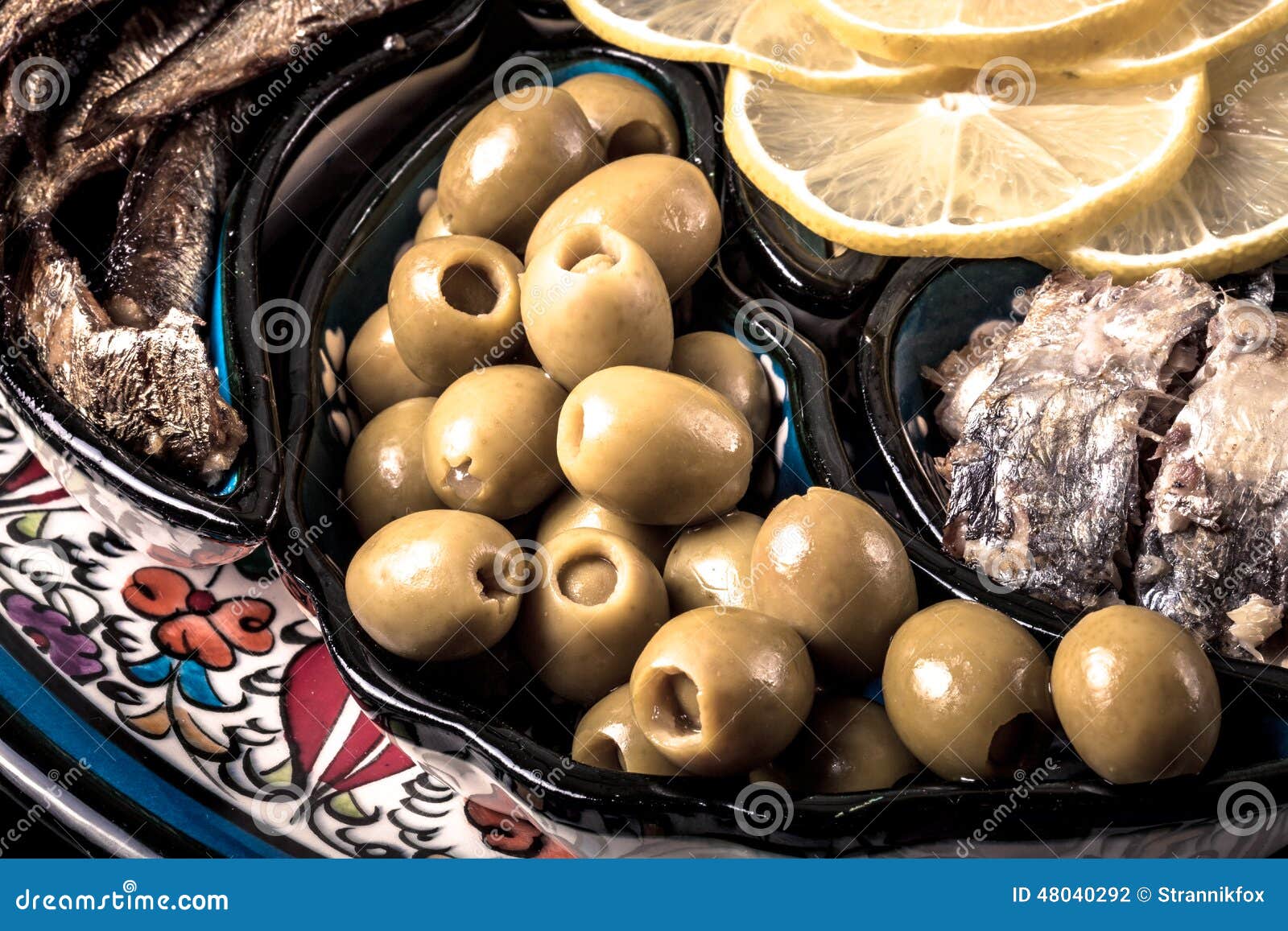 Assorted Fish on a Plate on a Dark Background Stock Photo - Image of ...