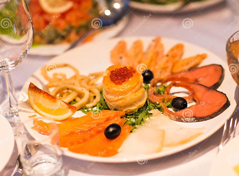 Assorted fish on a plate stock photo. Image of cook, banquet - 70030994