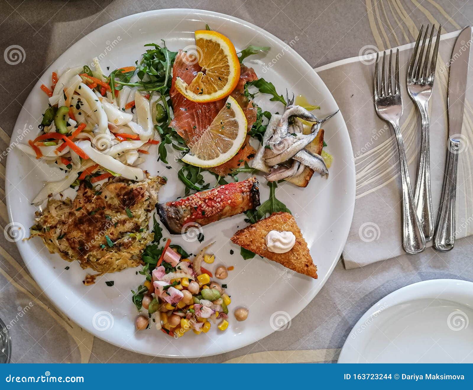 Assorted Fish and Seafood Served on a White Plate Stock Photo - Image ...