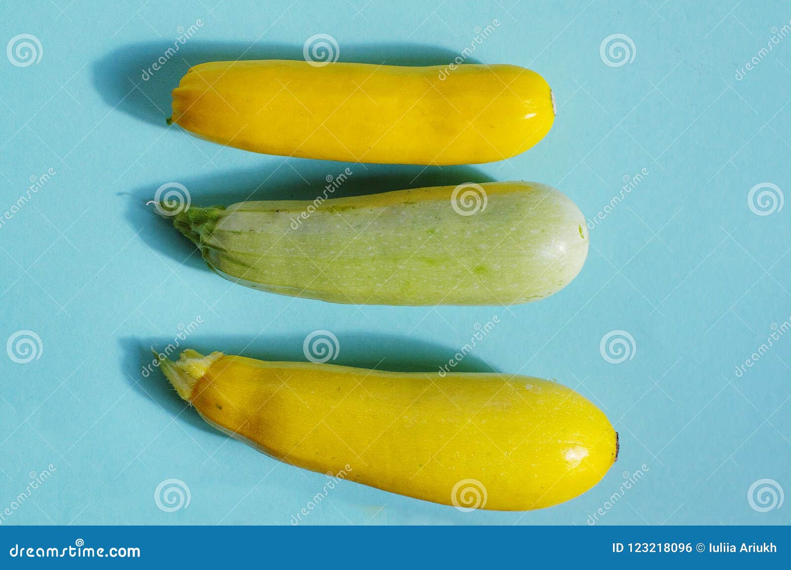 Assorted Fresh Multicolored Zucchini on a Blue Background Stock Photo ...